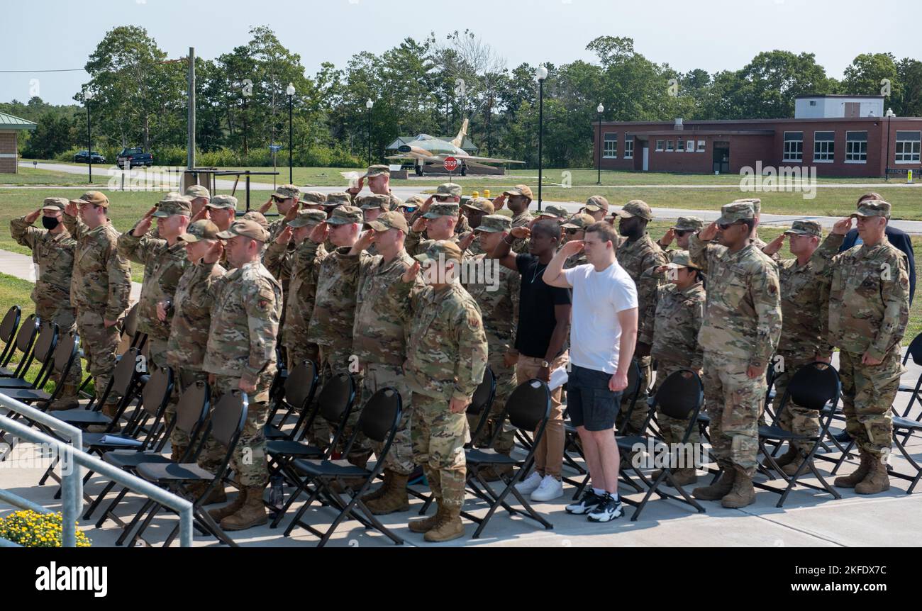 Members of the 102nd LRS render a saulte at the ceremony. The 102nd ...
