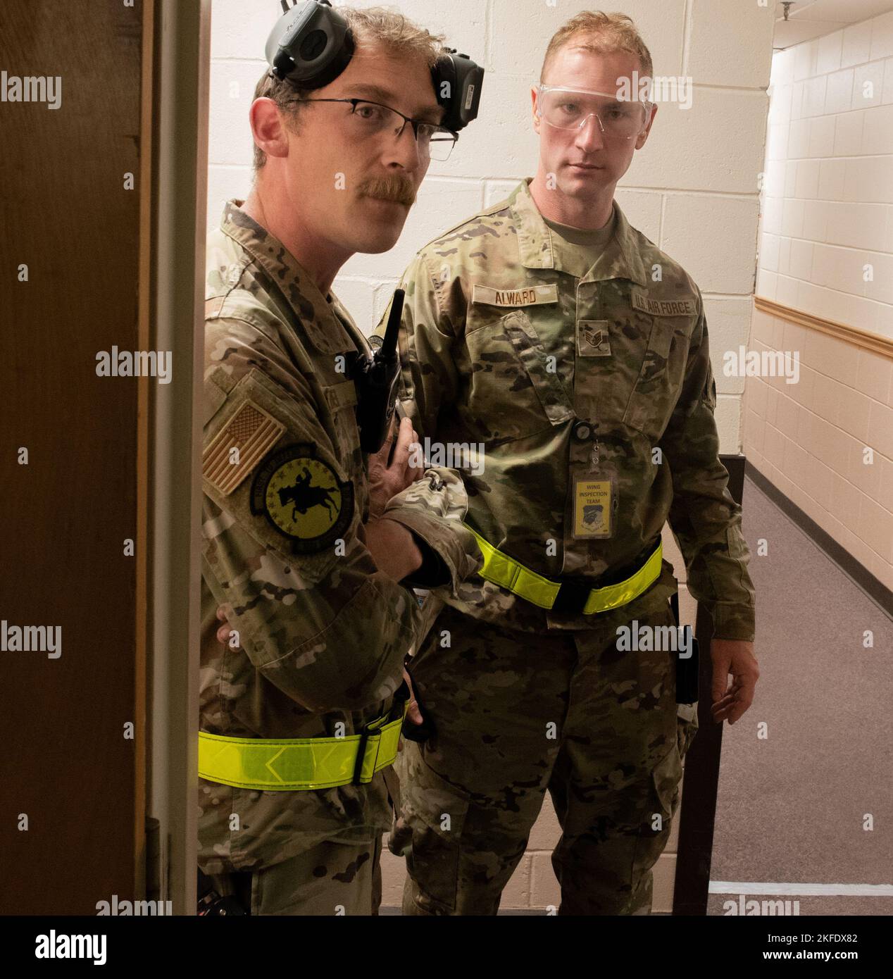 Master Sgt. Kevin Miner and Staff Sgt. Paul Alward look on and evaluate ...