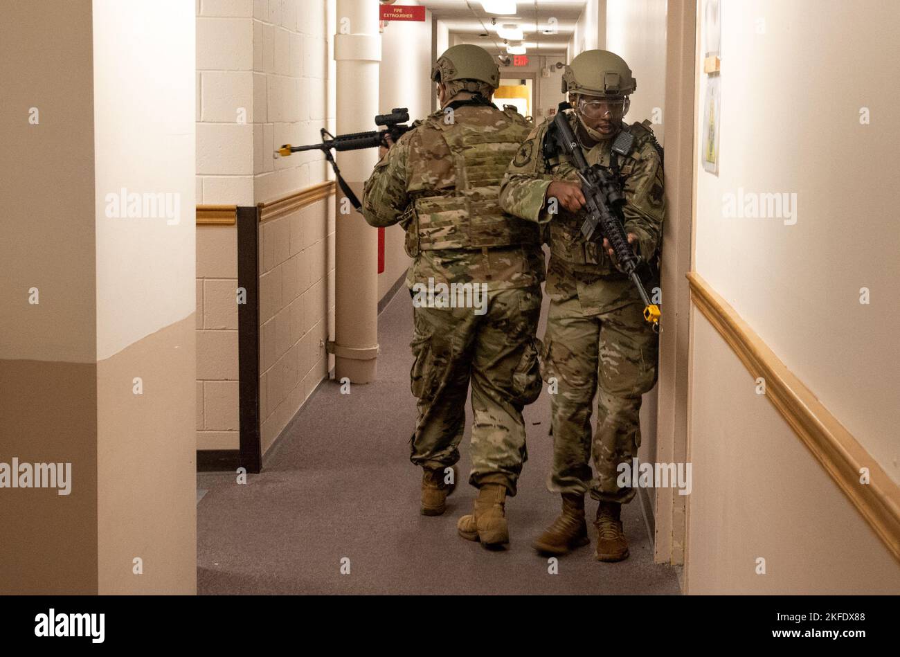 Defenders from the 102nd Security Forces Squadron prepare to breach and ...