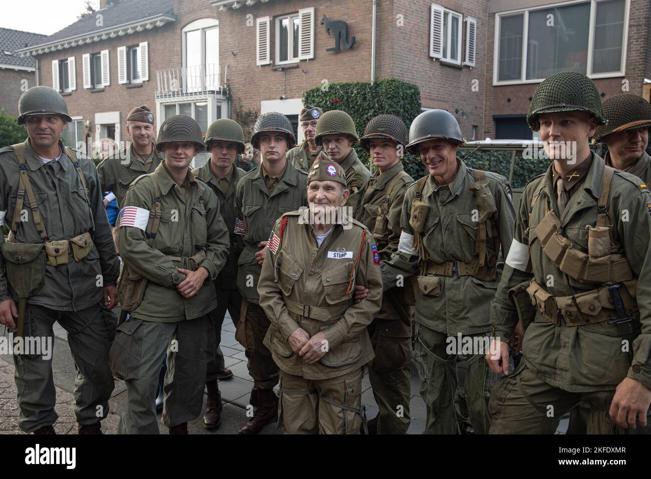 WWII Veteran Clifford Stump stands for a photo with a group known as ...