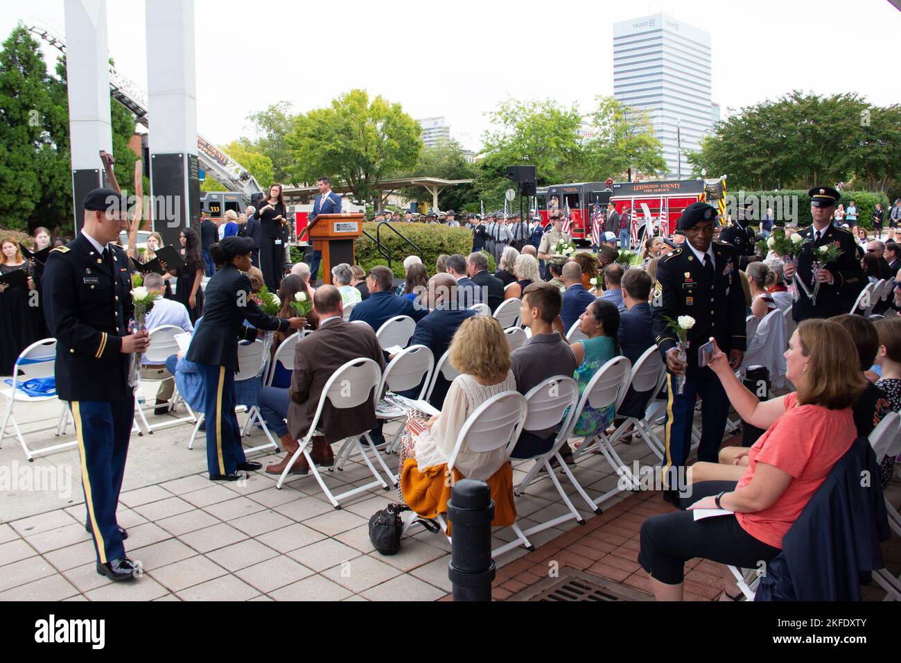 U.S. Army National Guard Soldiers with the South Carolina National Guard, present flowers to ...