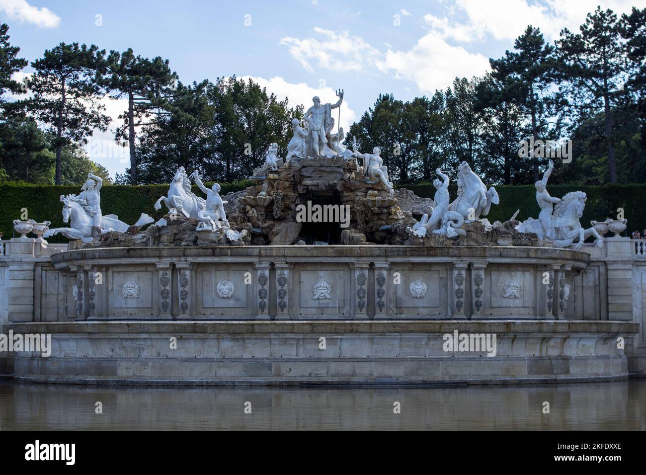 The Neptune Fountain with white marble sculptures in Vienna, Austria ...