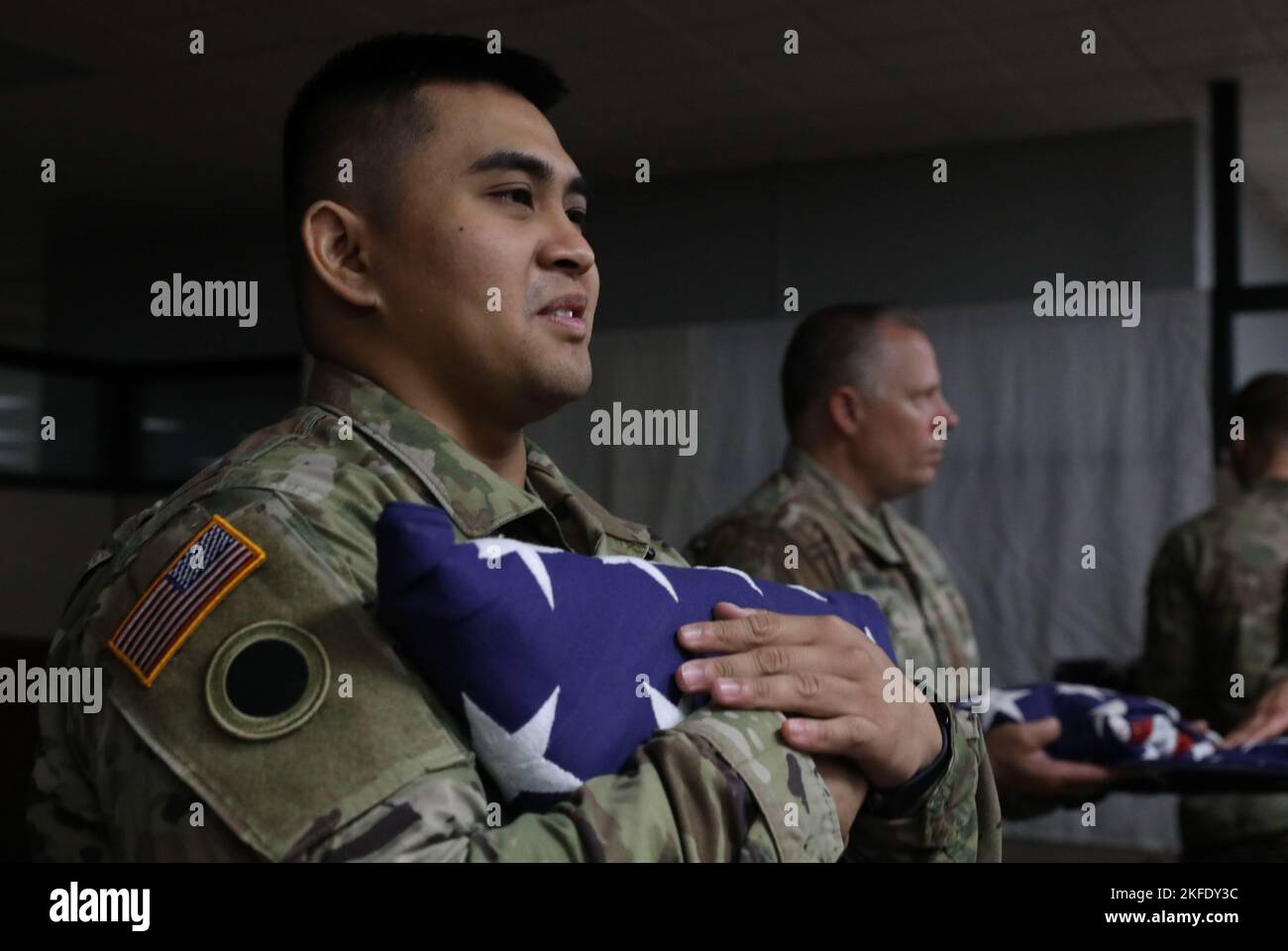 U.S. Army Reserve Spc. Dean Do practices conducting a flag folding ...