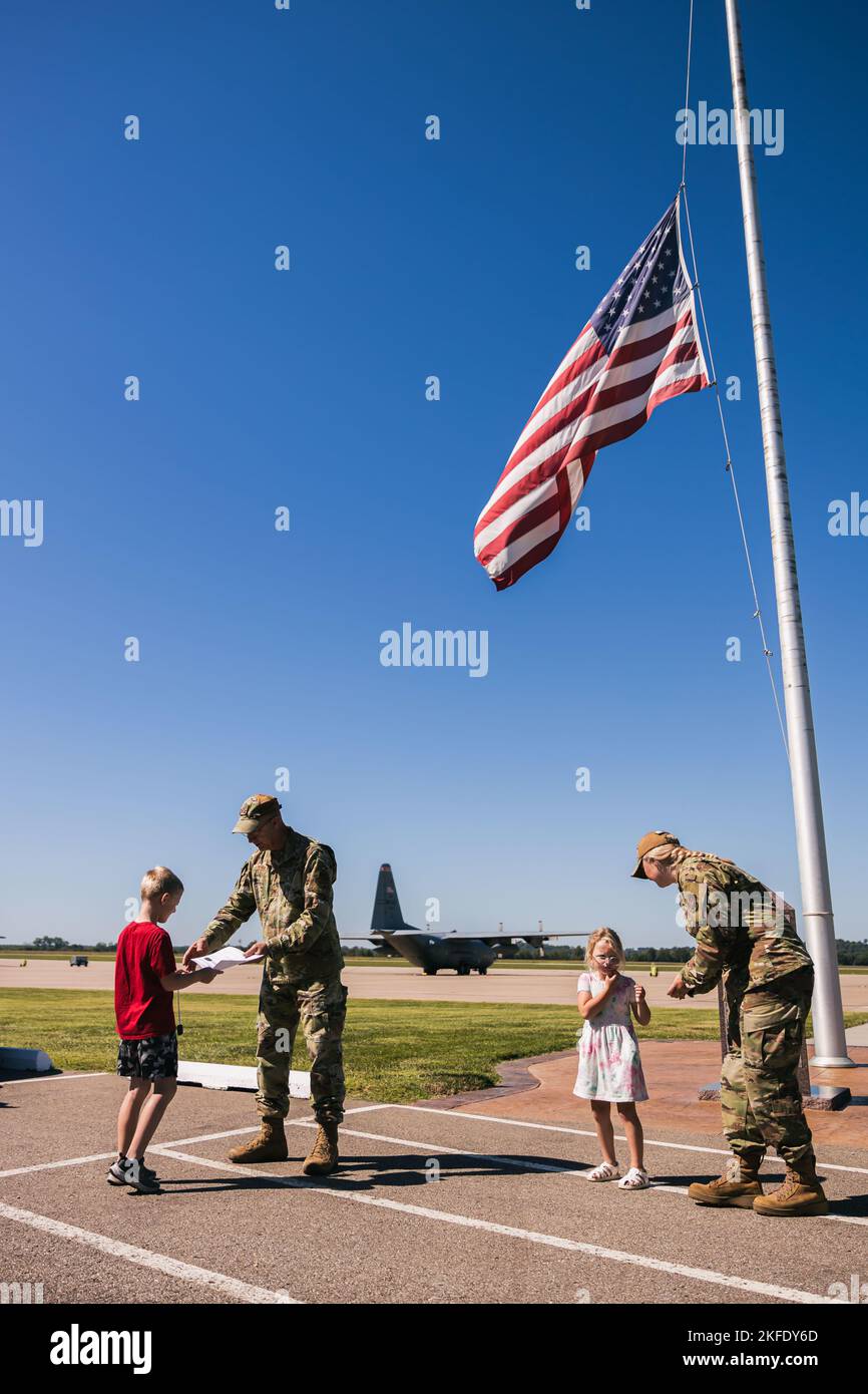 U.S. Air Force Col. Gordon Meyer presents the Home Front Hero Award to ...