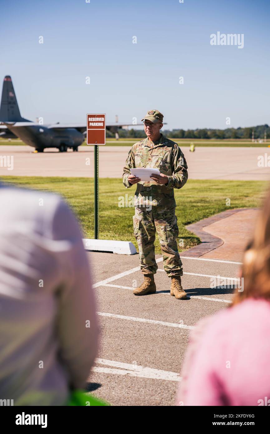 U.S. Air Force Col. Gordon Meyer presents the Home Front Hero Award to ...