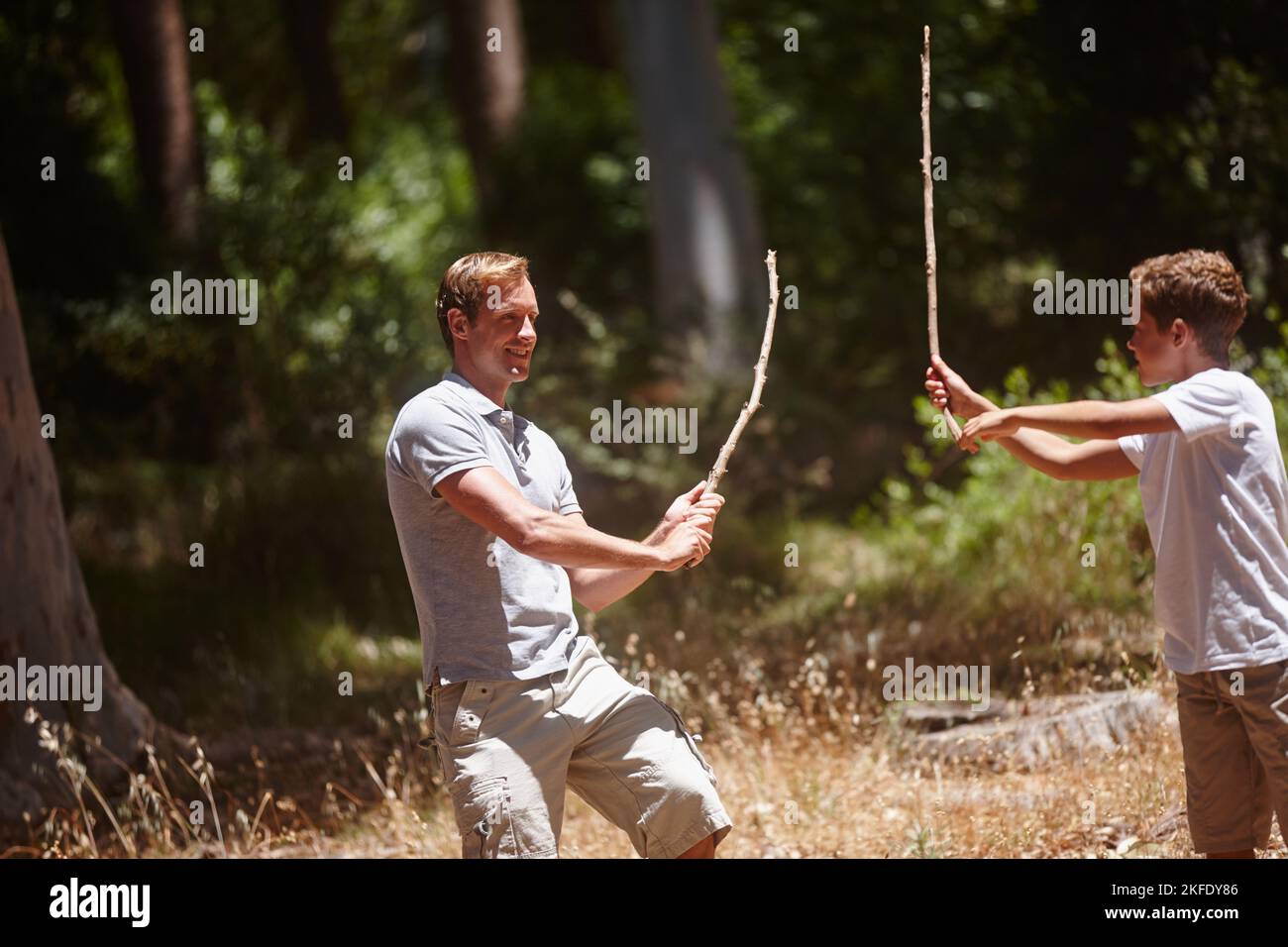 Playing with toys from the forest. a young father and son playing with ...