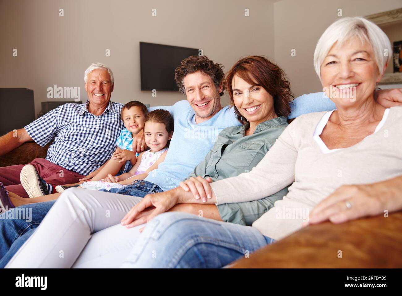 Making time for family. Portrait of a happy multi-generational family ...
