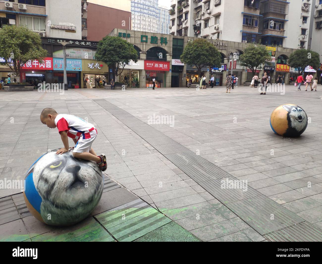 Four stone piers painted with funny dog face attract passers-by's ...