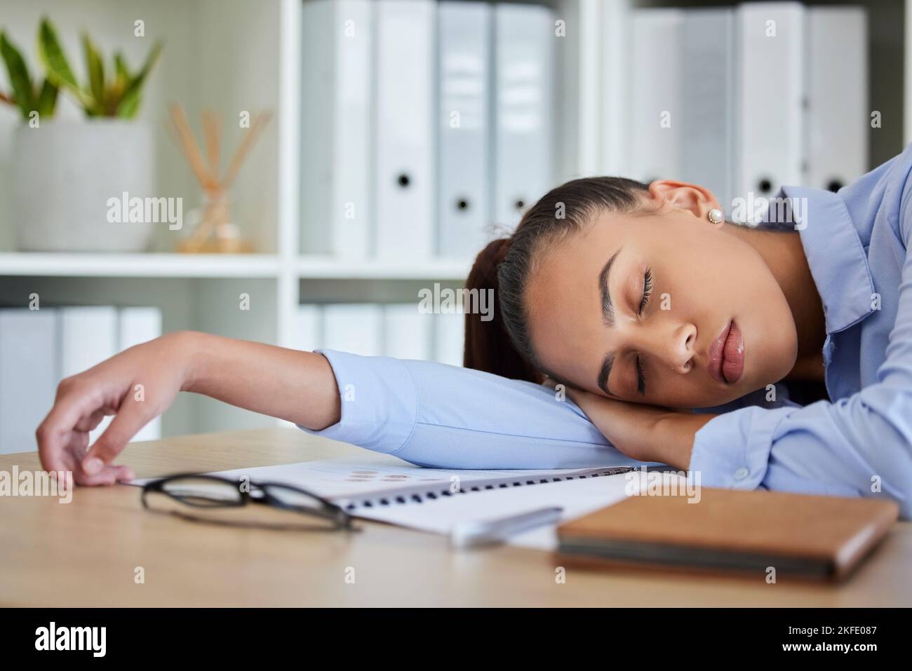 Tired, sleep and woman in business on her table feeling burnout and ...