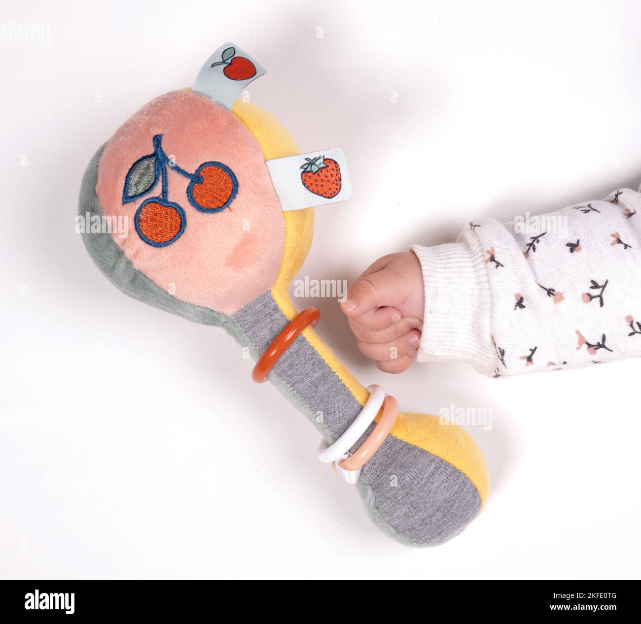 Baby hand (female) reaching for a toy, isolated on white background ...