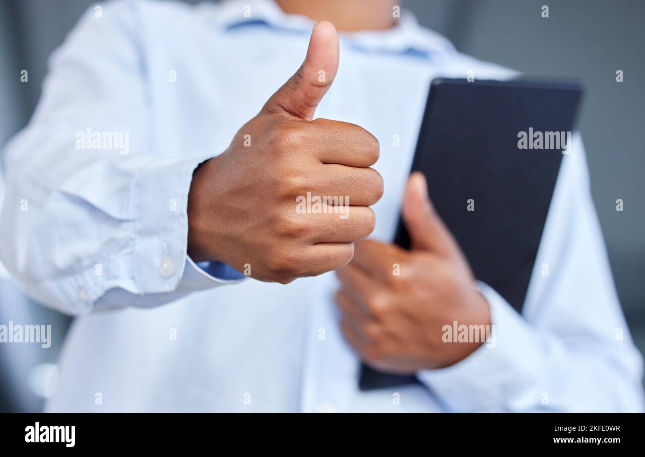 Business, technology and hand with tablet and thumbs up for success ...