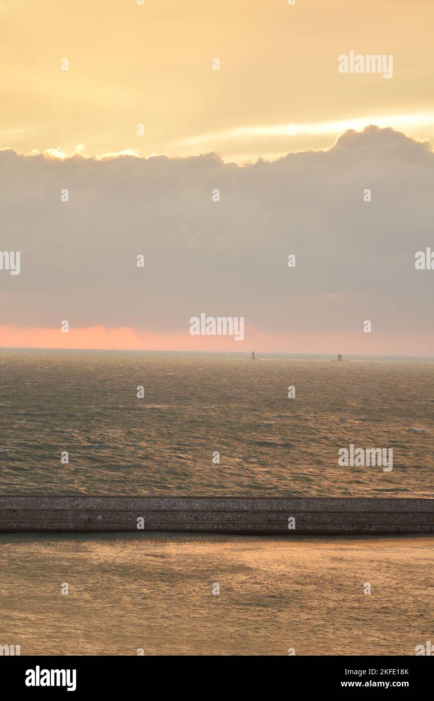 Sunset with clouds over Ocean oastell calm background Stock Photo - Alamy
