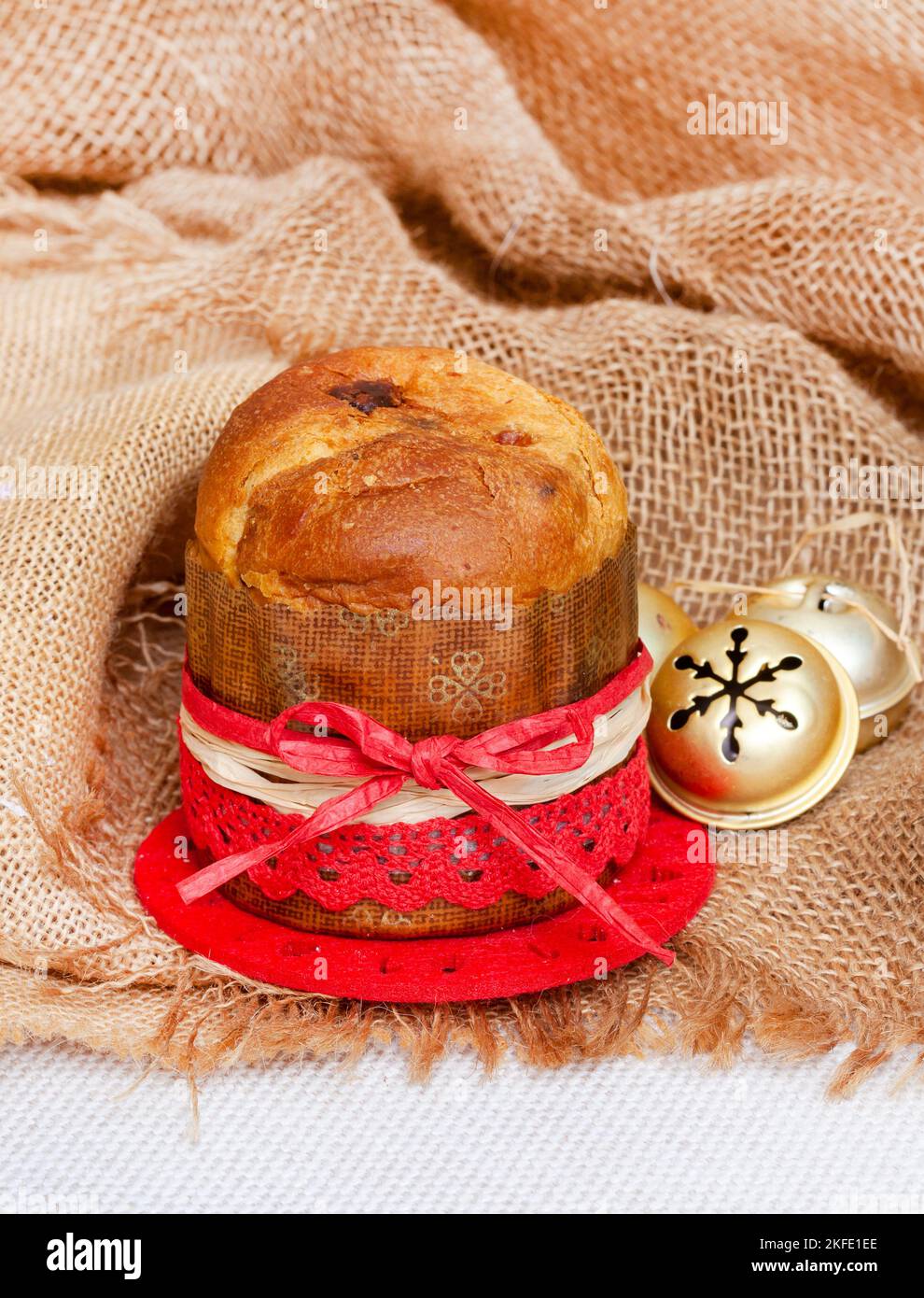 small panettone with Christmas ribbon on rustic table Stock Photo - Alamy