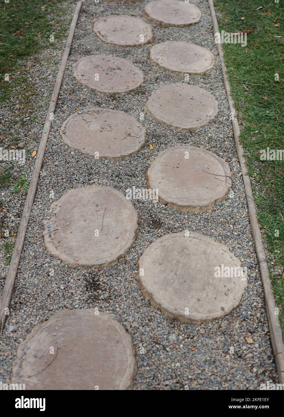 Path of plated stones on gravel bed. Garden architecture, pathway ...