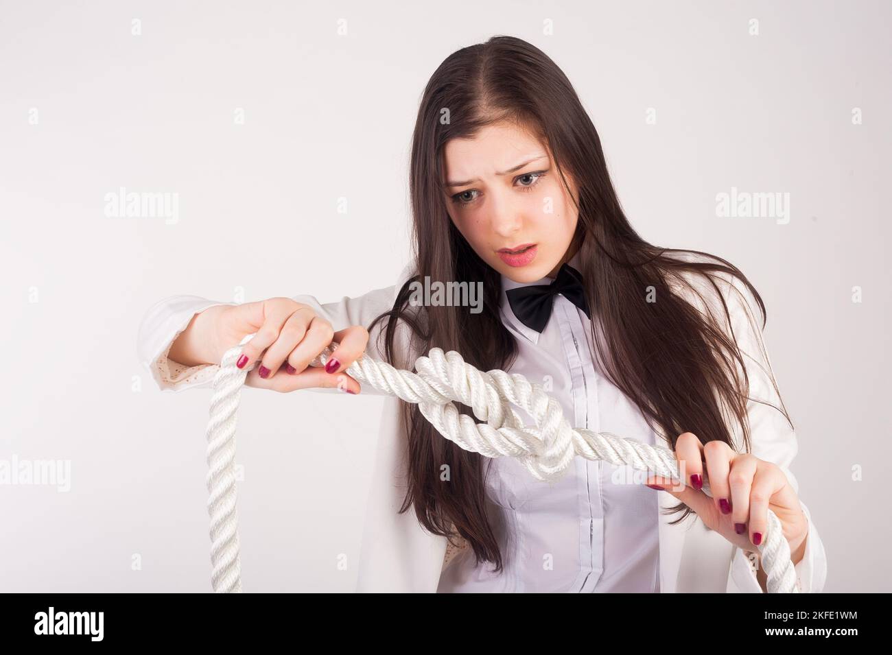 Woman holding rope knot hi-res stock photography and images - Alamy