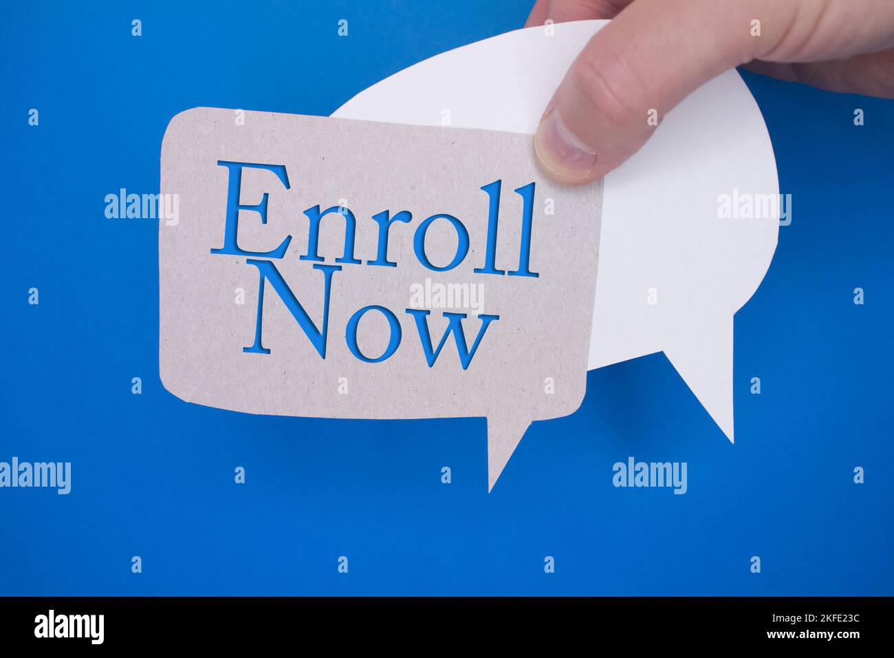 Speech bubble in front of colored background with Enroll Now text Stock ...