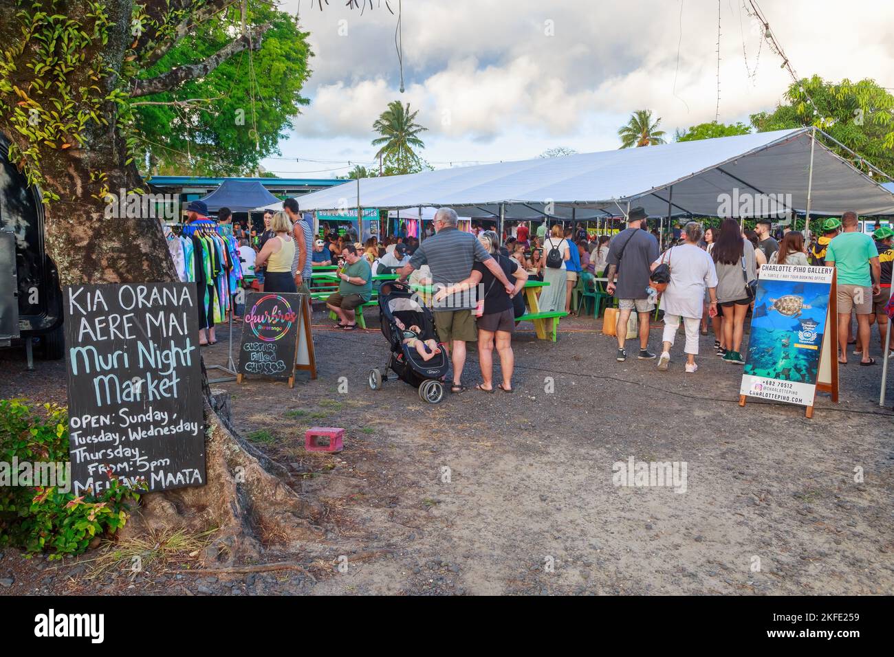 A crowd of people at the Muri night market on the island of Rarotonga ...