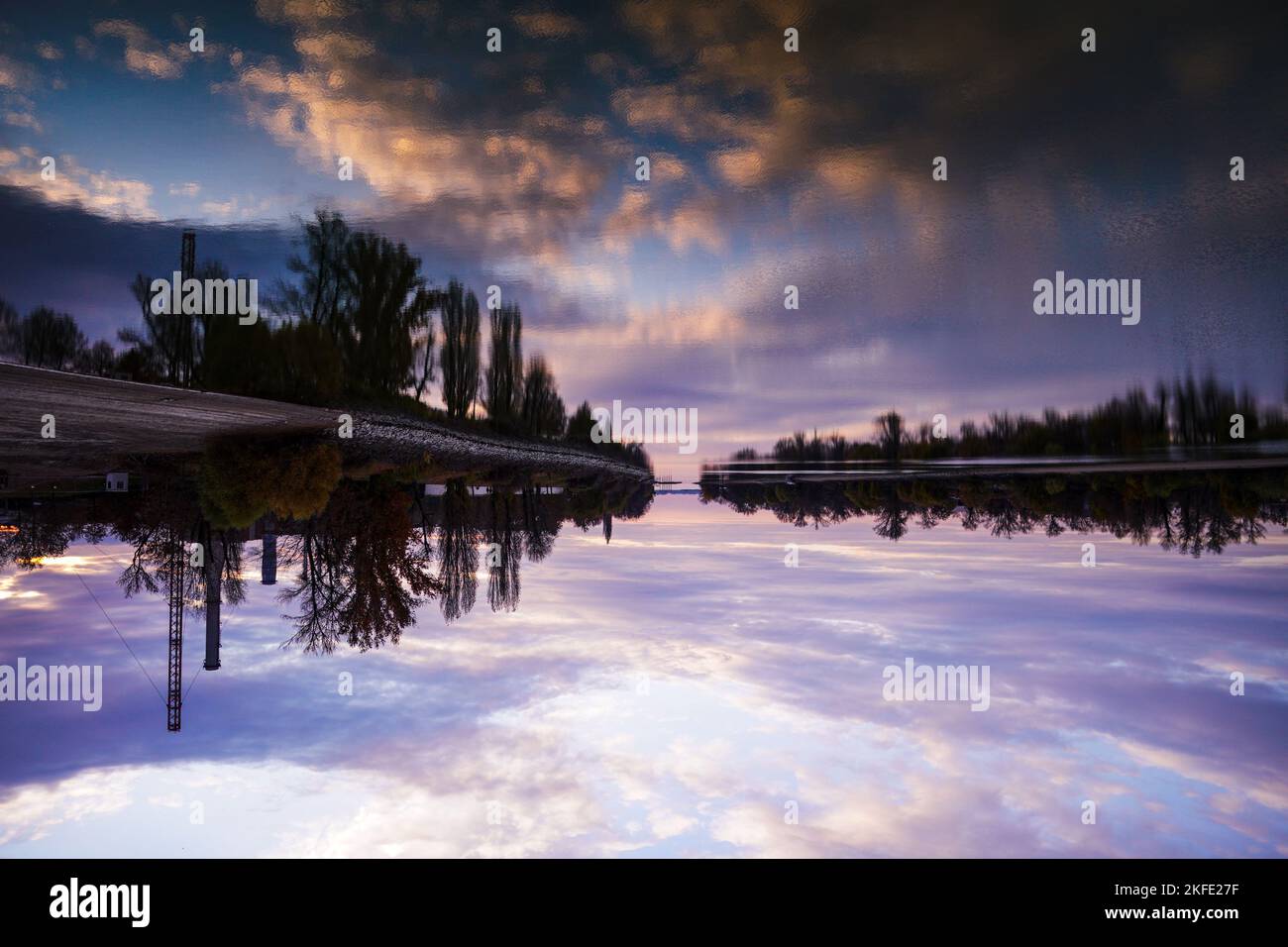 A landscape of the Danube surrounded by trees on a gloomy morning in ...