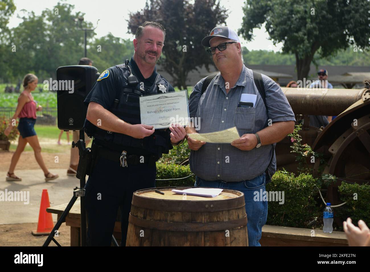 Wheatland Police Officer Kirk Rekers (left) receives a certificate from ...