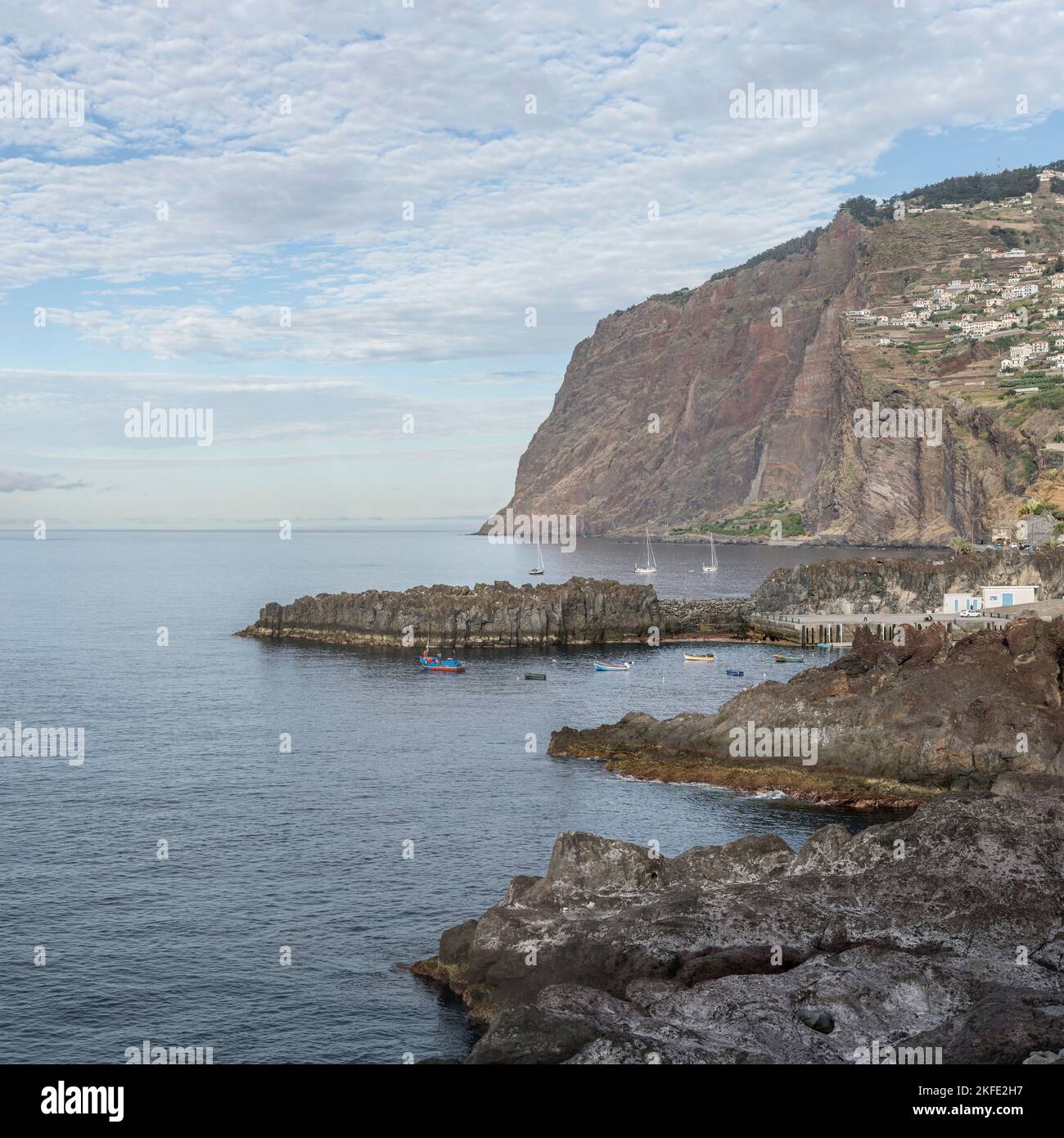 basalt dikes at village harbor on Atlantic shore at Madeira, shot in ...