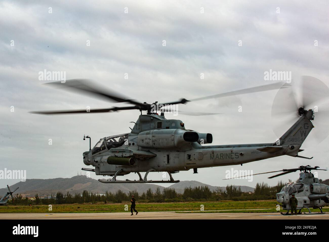 An AH-1Z Viper attack helicopter with Marine Light Attack Helicopter ...