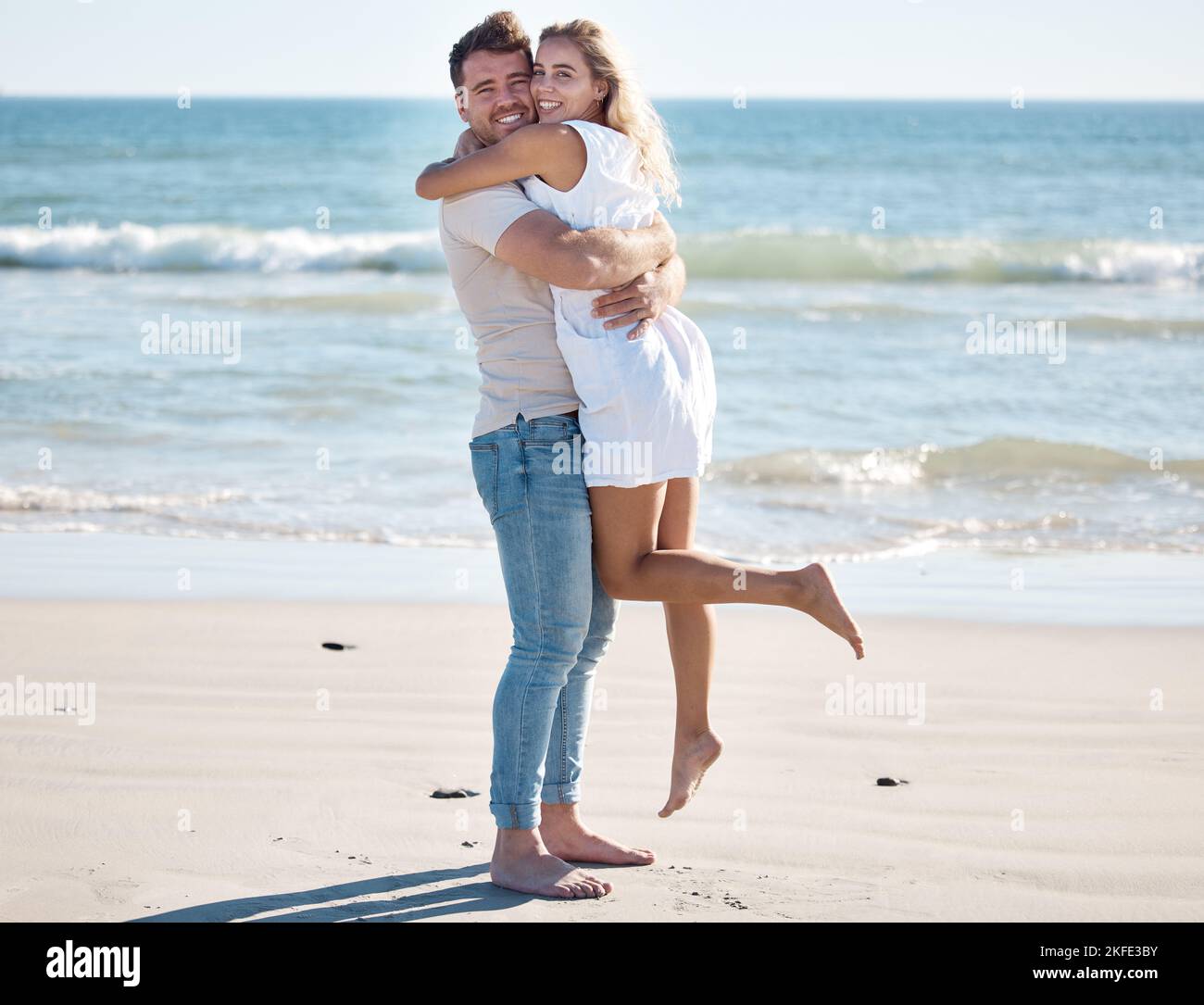 Hug, love and portrait of a couple on the beach on a summer vacation ...