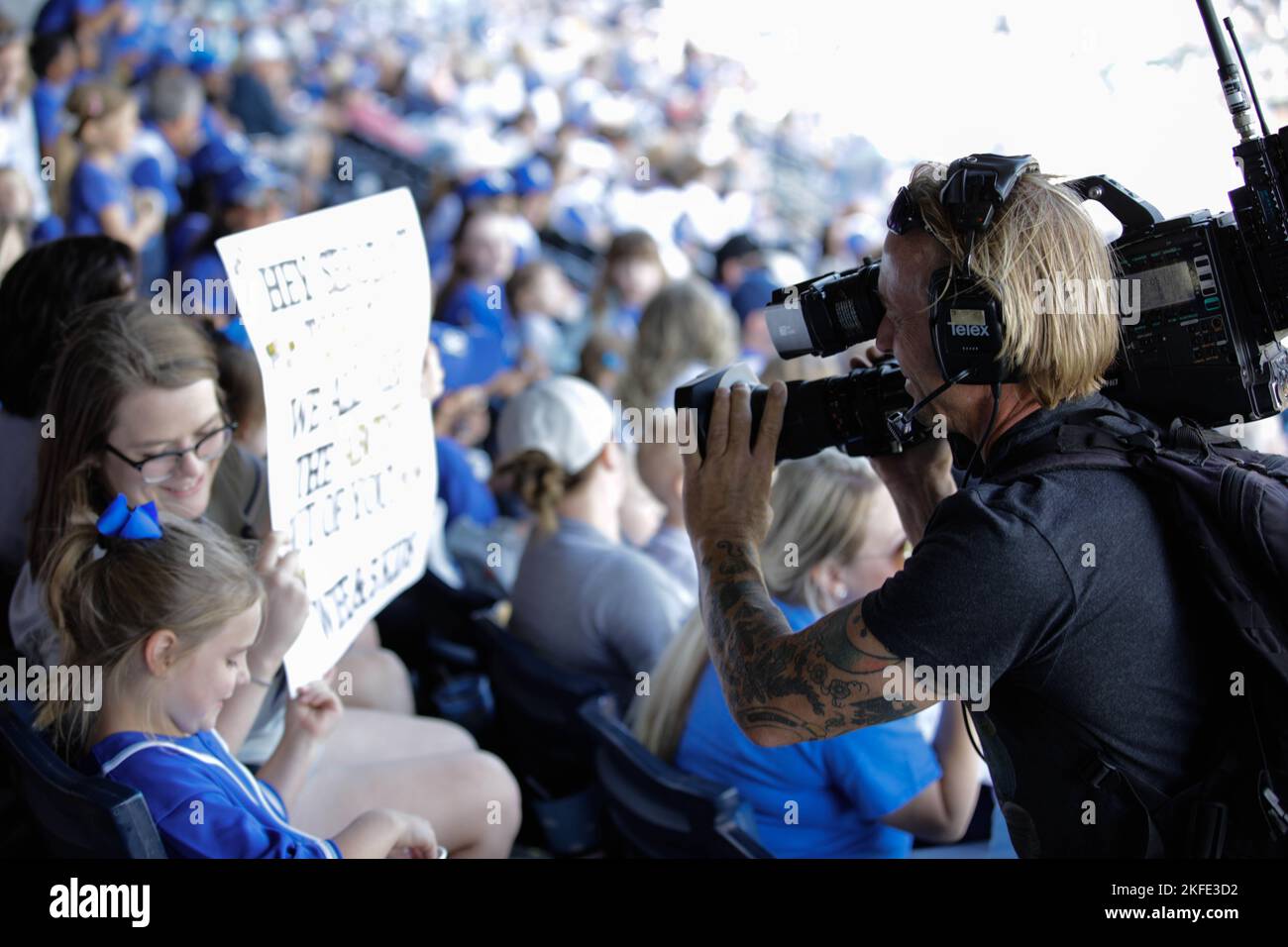 Sgt. Townsdin’s family holds a sign for the camera man at Kauffman ...