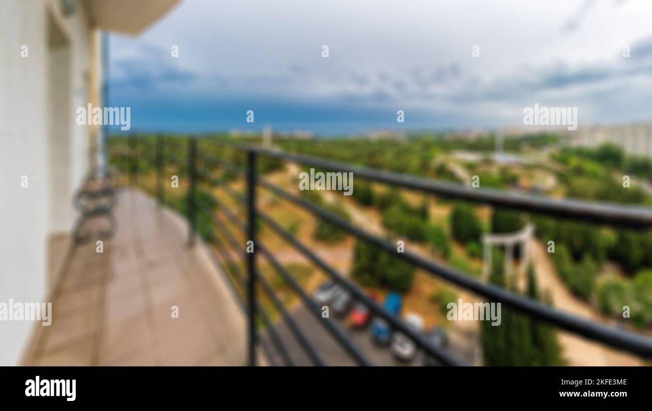 Abstract defocused city view with cloudy sky, view from high floor of ...