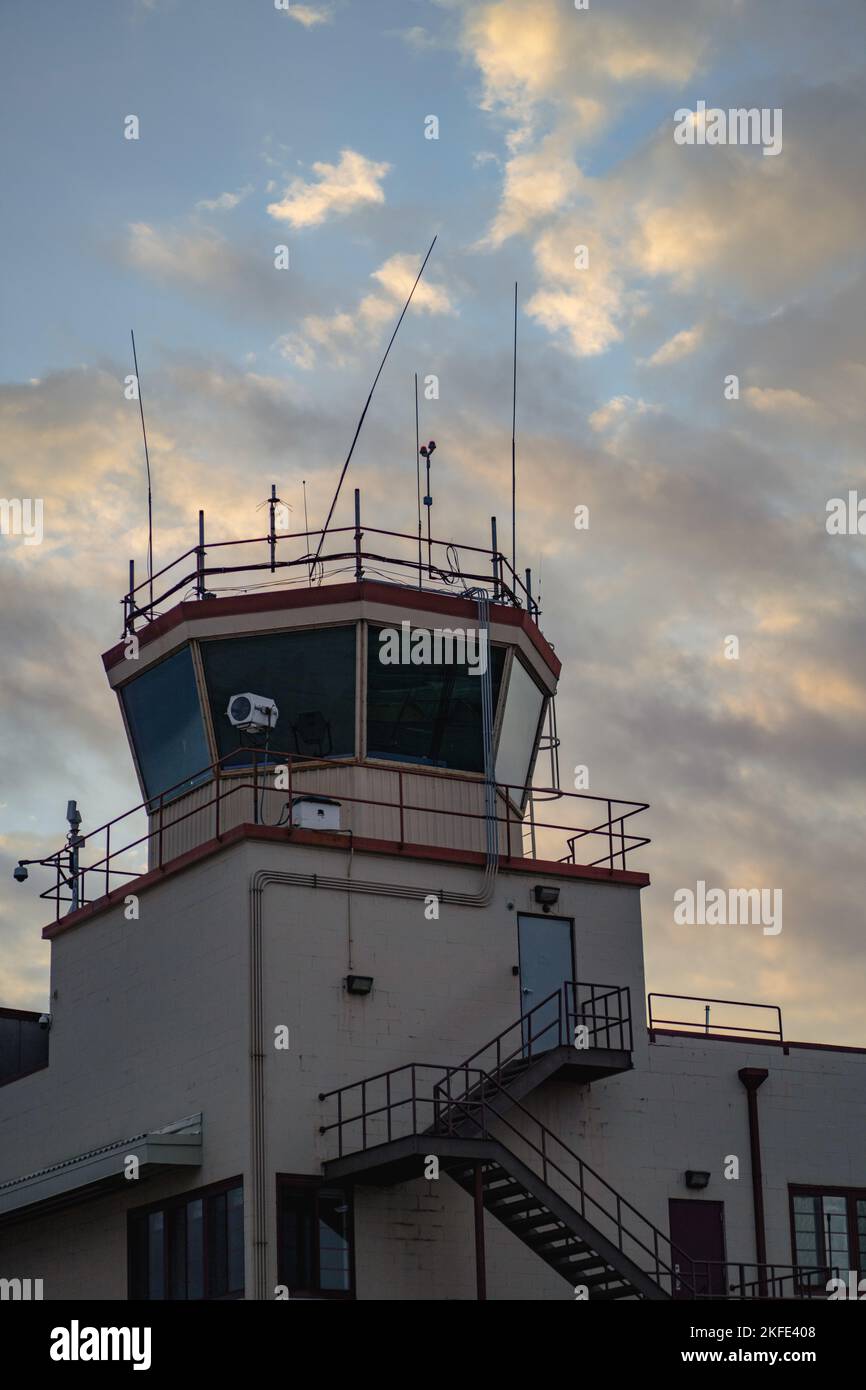 The sun rises behind a radio tower before a stair climb with Aircraft ...