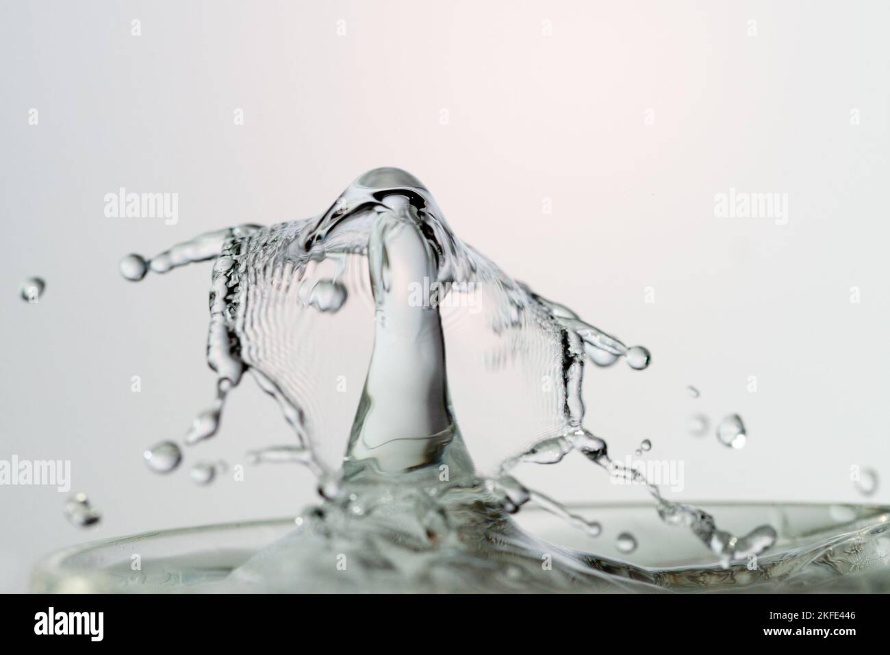 Water Drop with Ripples on water surface Stock Photo - Alamy