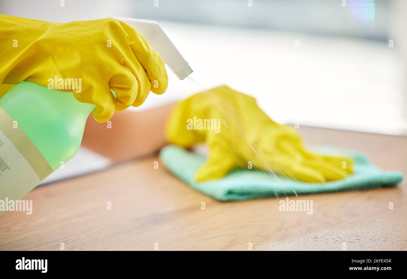 Cleaning, spray and hands of woman with table furniture for healthcare ...