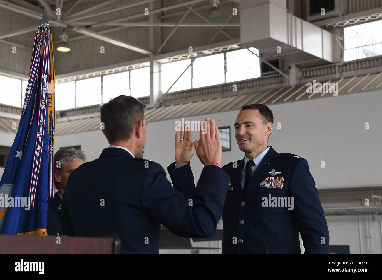 Col. Christopher Clark accepts the 144th Fighter Wing guidon from U.S. Air Force Brig. Gen ...