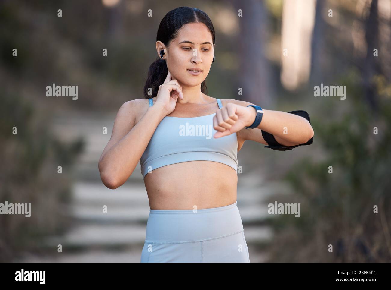 Fitness, exercise and woman with smartwatch to check pulse, progress ...