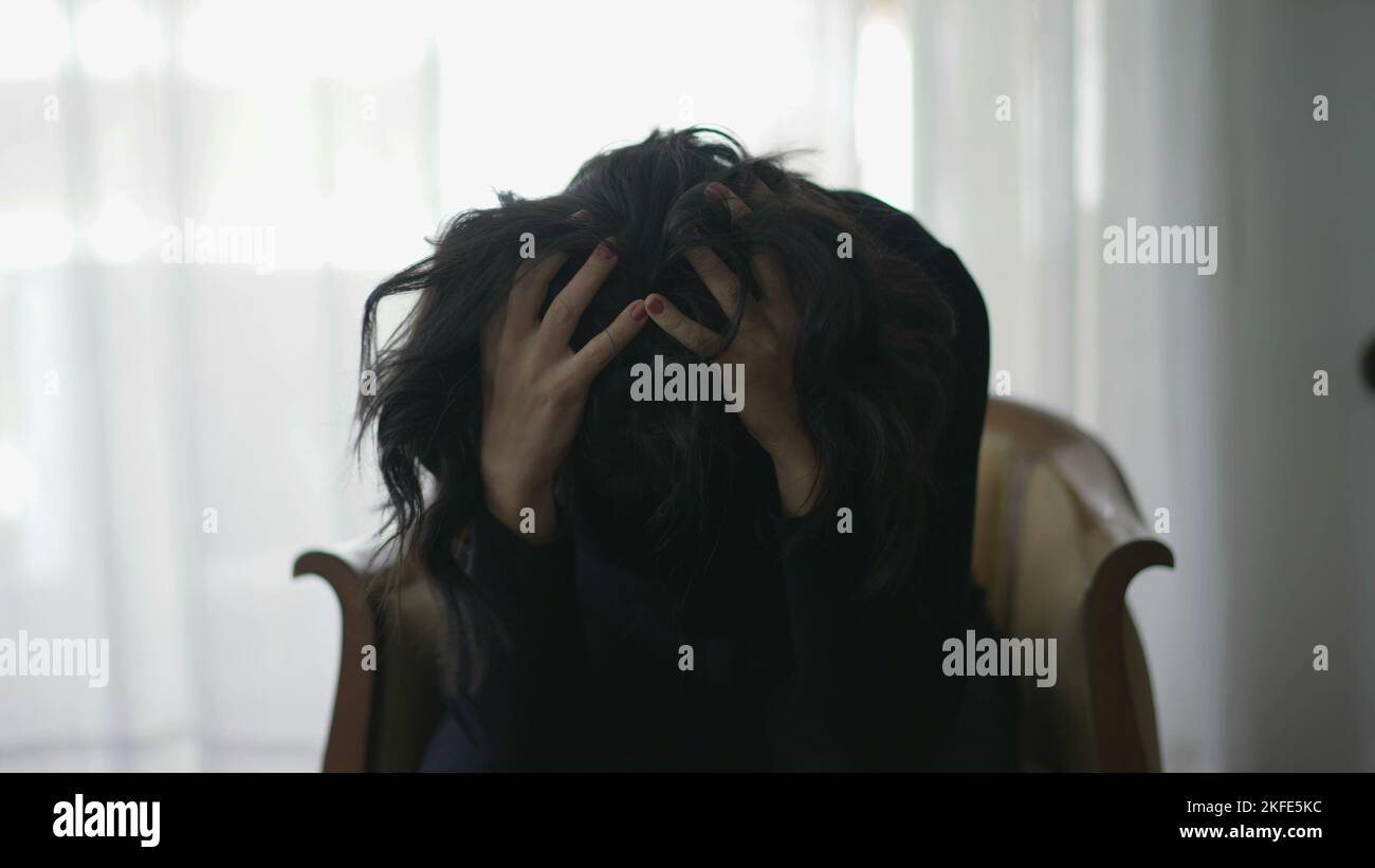 Woman covering face in shame suffering from emotional pain Stock Photo ...