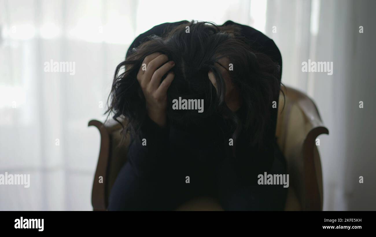 Woman covering face in shame suffering from emotional pain Stock Photo ...