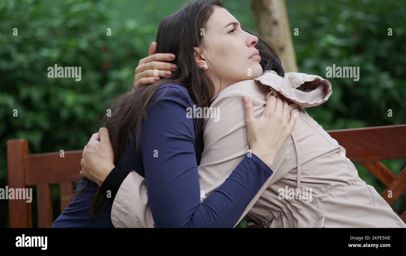 Woman helping DEPRESSED female friend hugging in SUPPORT. Two women ...