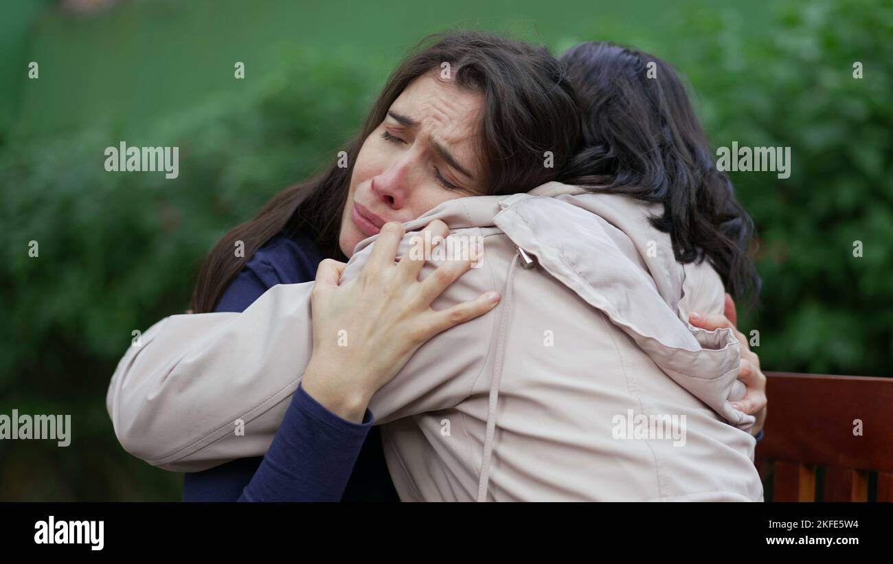 Sad woman suffering from negative emotion. Two women embracing each ...