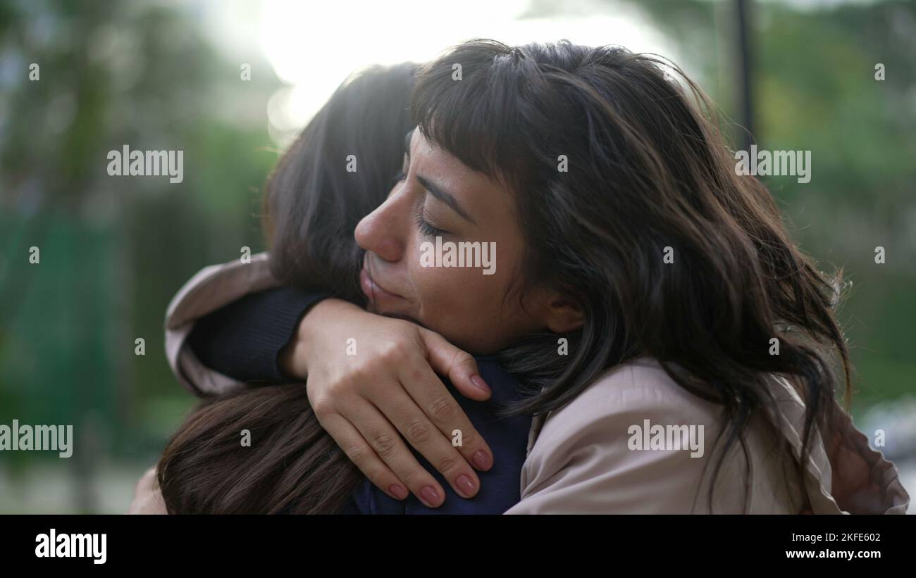 Sympathetic woman hugging friend with EMPATHY and SUPPORT. Friendship ...