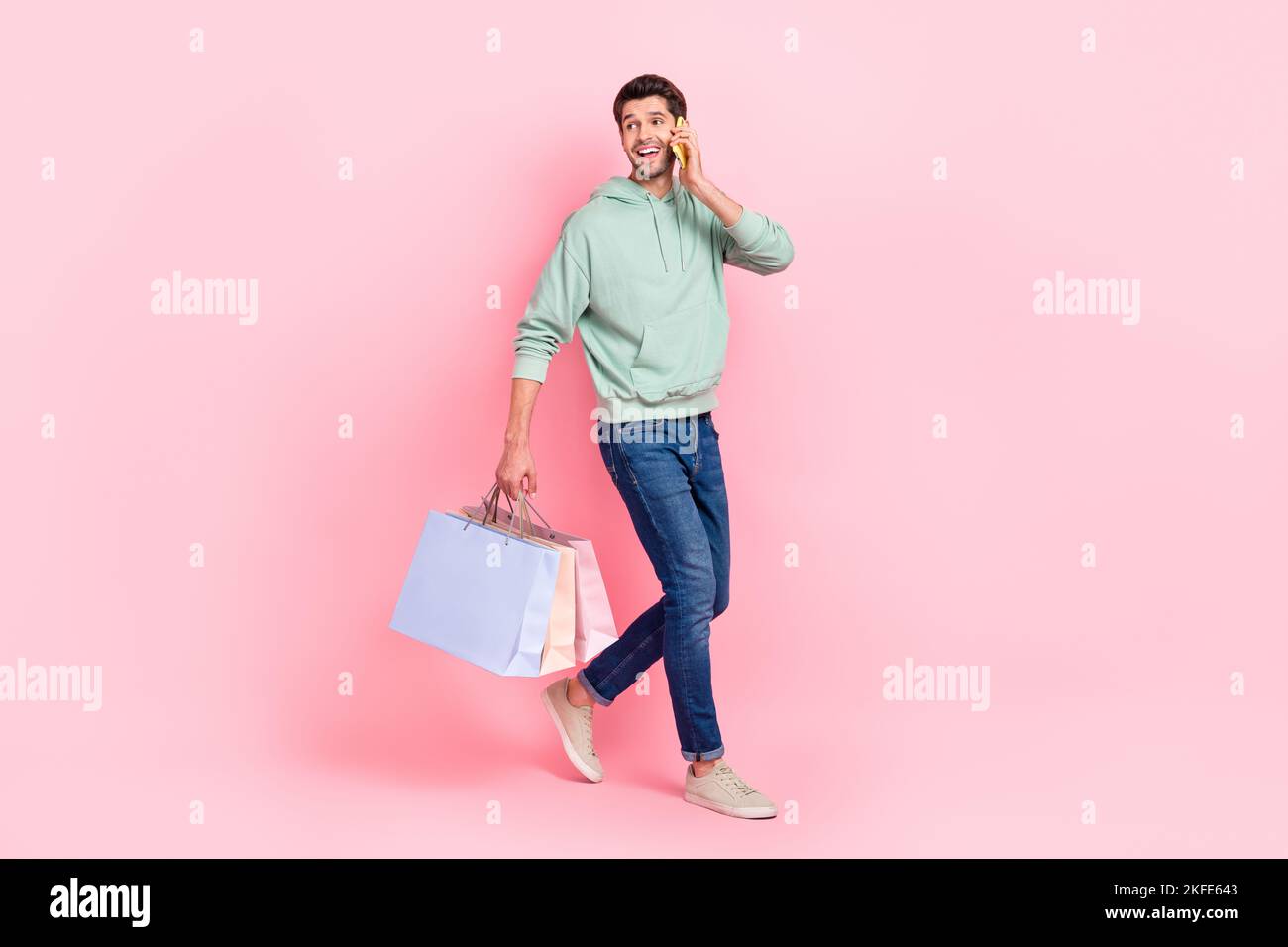 Full length photo of attractive stylish man look empty space speak make ...