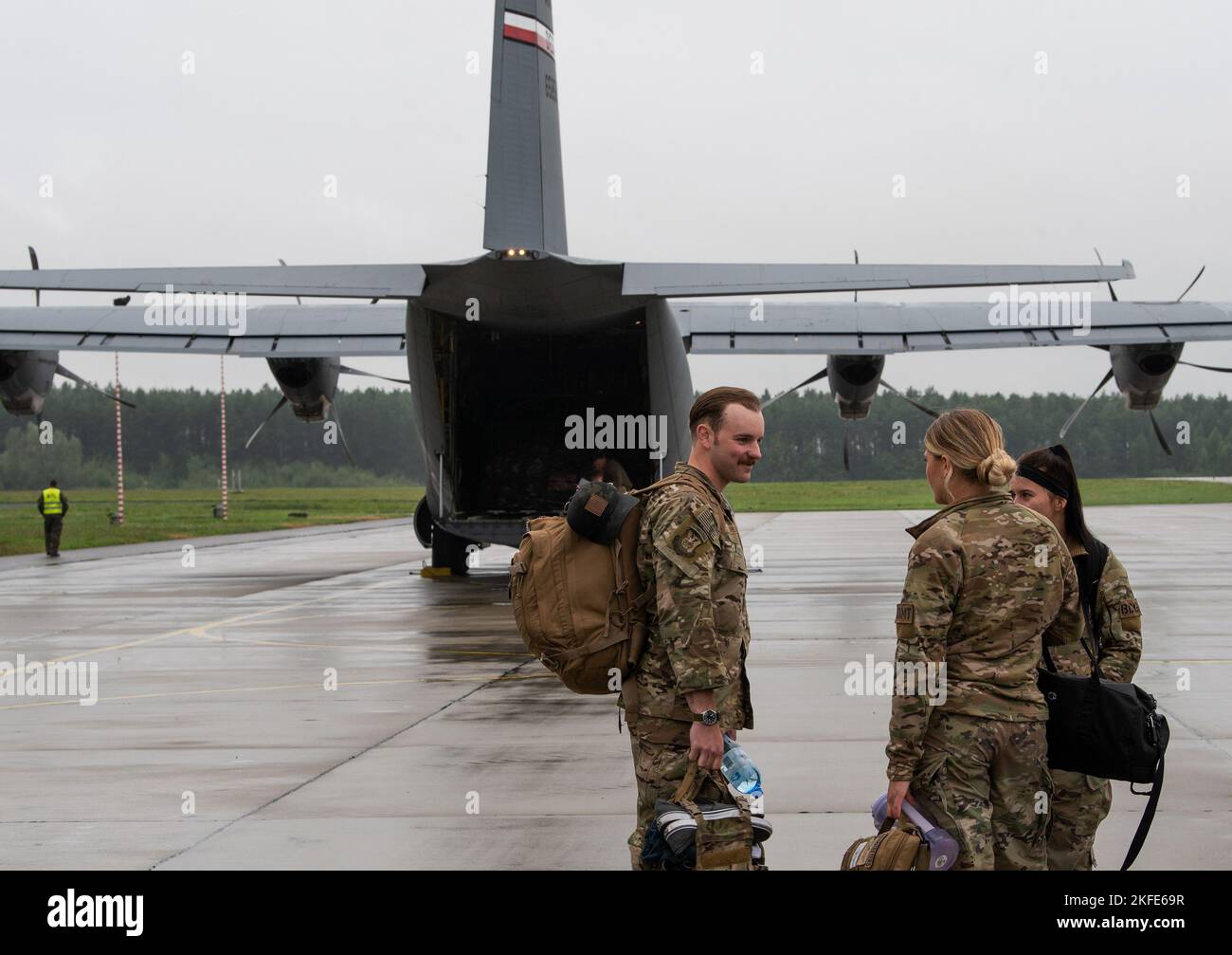 U.S. Air Force Airmen assigned to 824th Base Defense Squadron wait to ...
