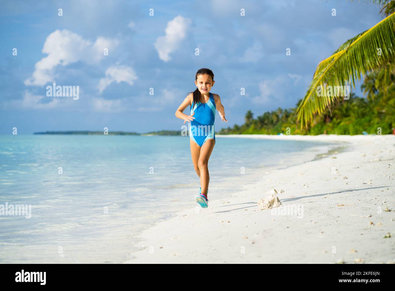 Happy Child Having Fun On Beach Playful Kid Person Stock Photo - Alamy