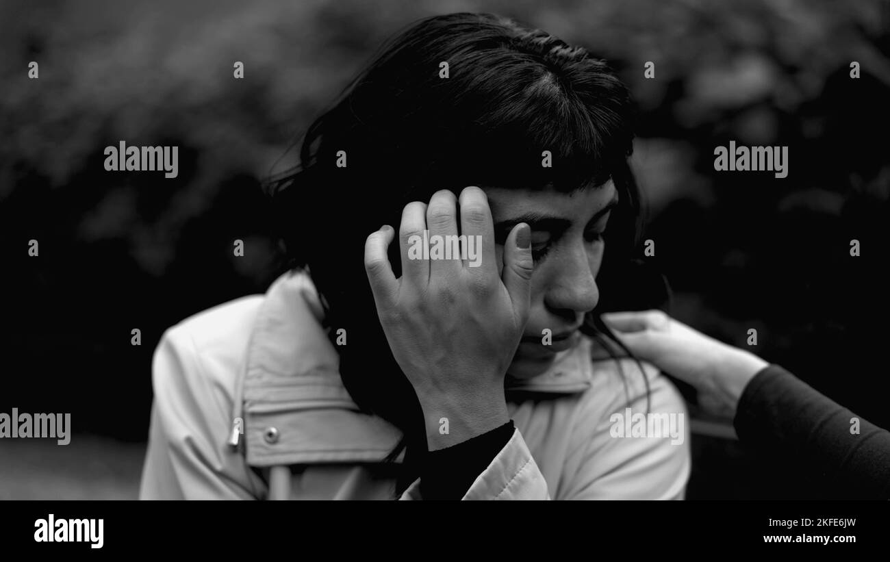 Two women hugging sad Black and White Stock Photos & Images - Alamy