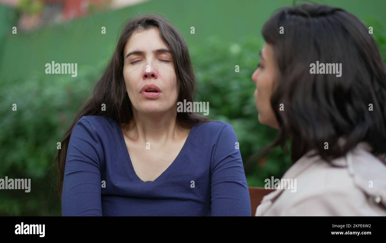 Depressed woman suffering with the help and support of female friend ...