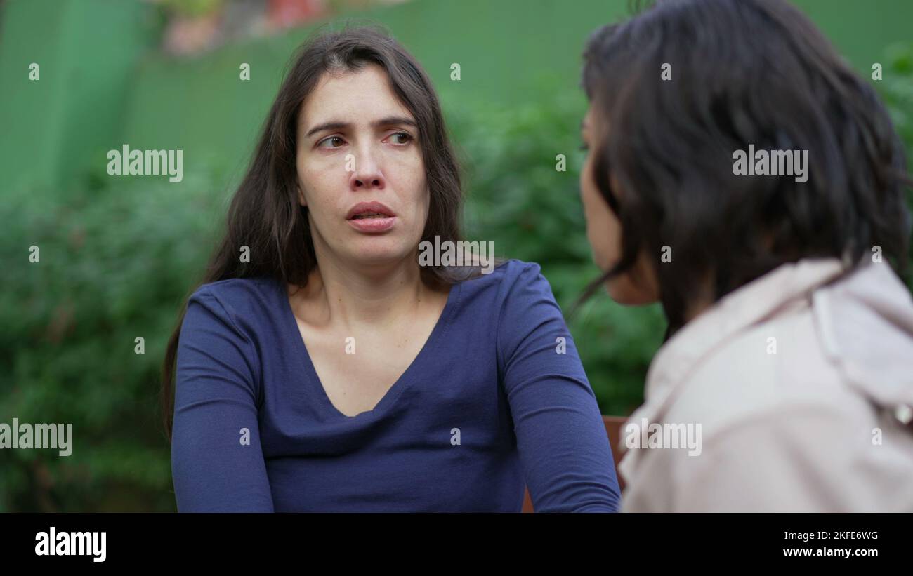 Depressed woman suffering with the help and support of female friend ...