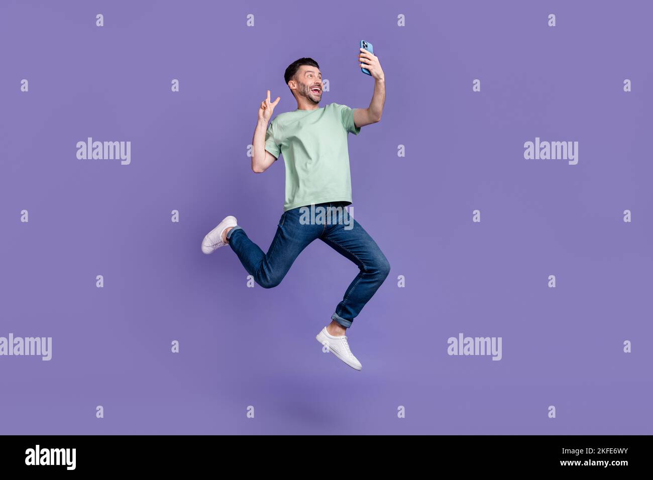 Full length photo of cheerful man blogger make self portrait ...