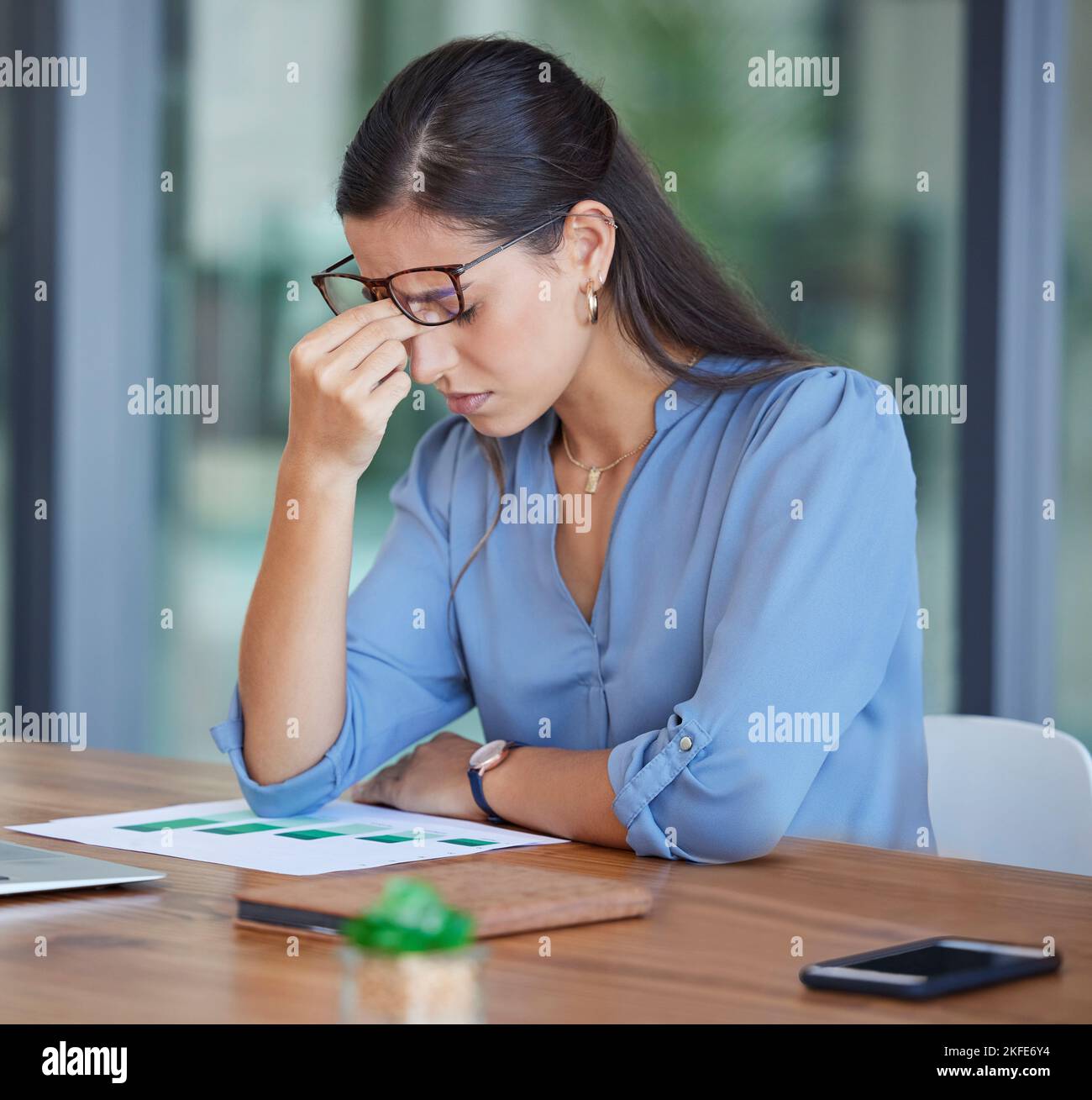 Tired, stress and headache business woman with marketing statistics ...