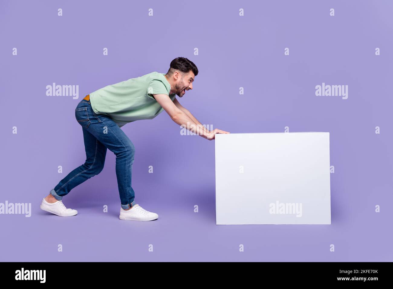 Full size photo of handsome young guy pushing white cube podium banner ...