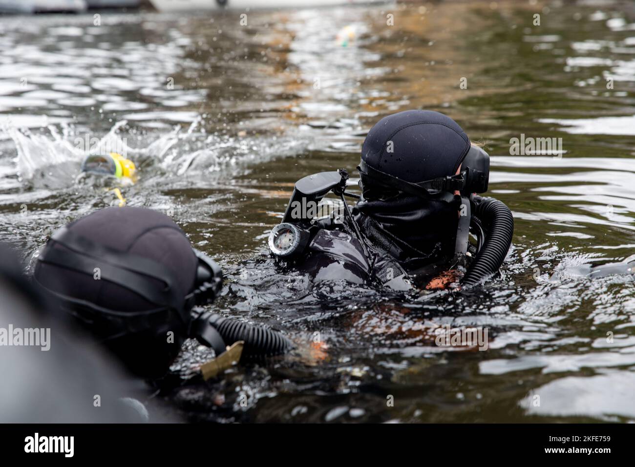 U.S. Navy SEALs assigned to a Naval Special Operations Team, tread ...