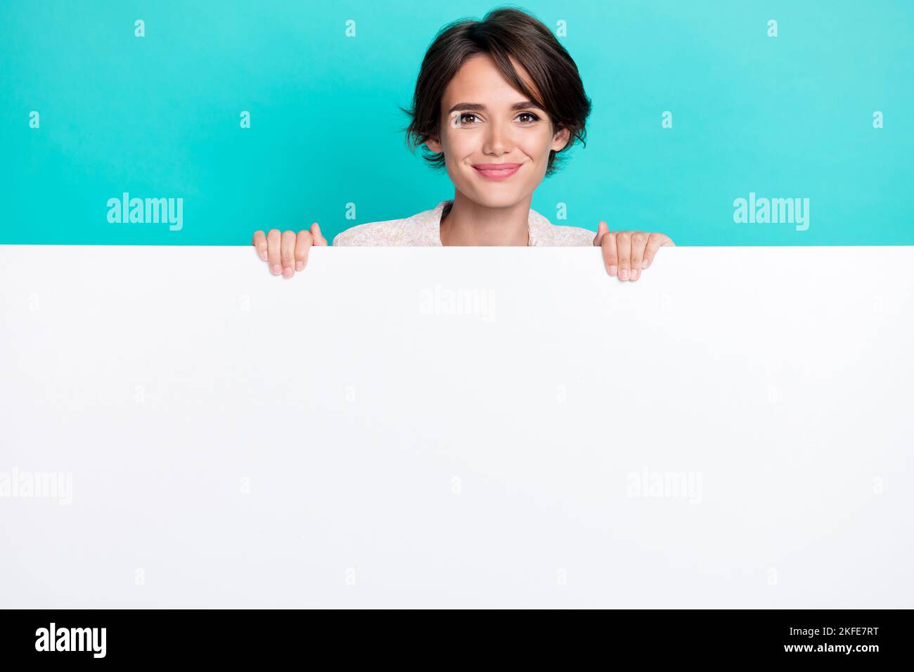 Photo of sweet bob hairdo lady hide under banner isolated on teal color ...