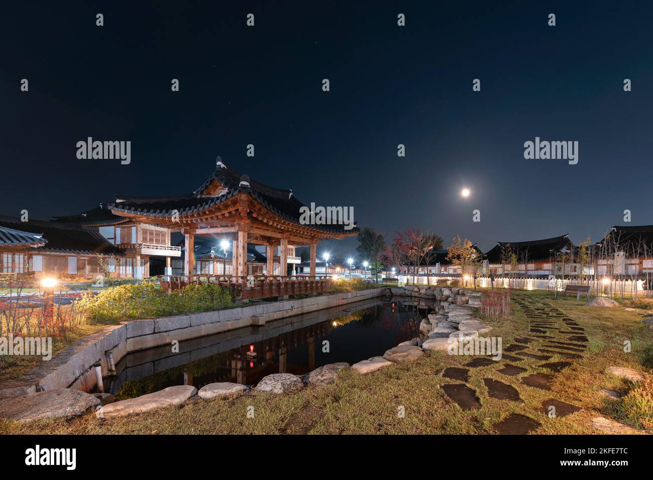 Architecture traditional oriental wooden house with pond in the night ...